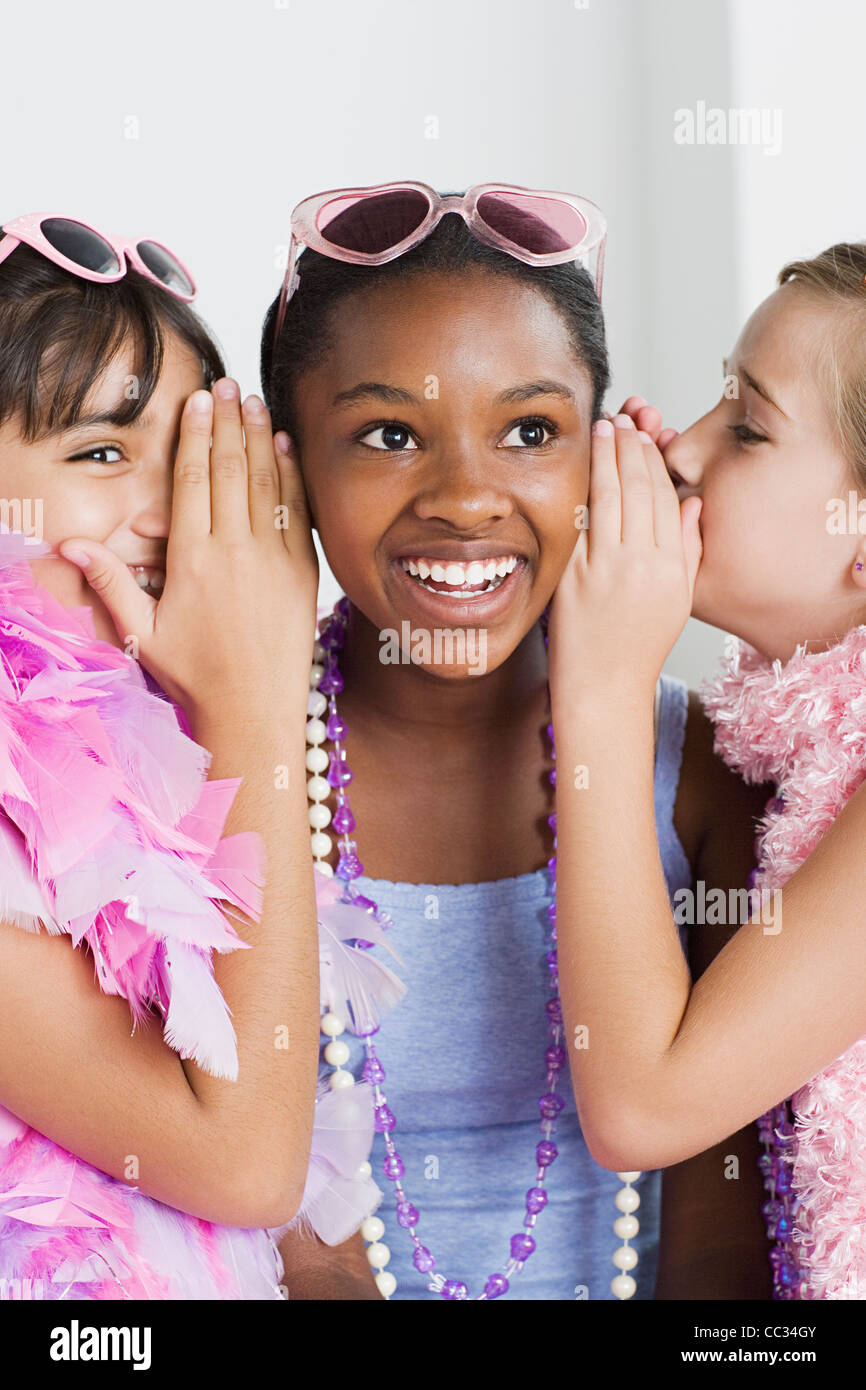 Three girls whispering hi-res stock photography and images - Alamy