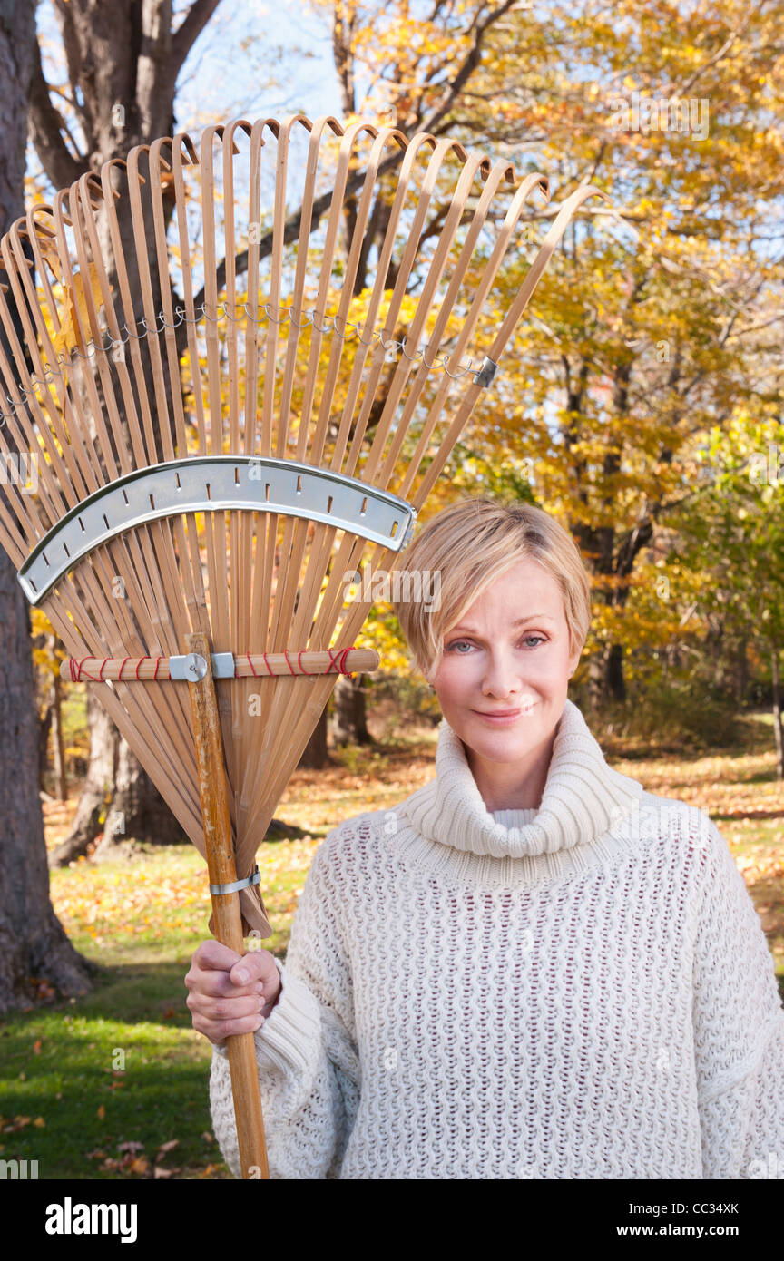 Woman with rake hi-res stock photography and images - Alamy