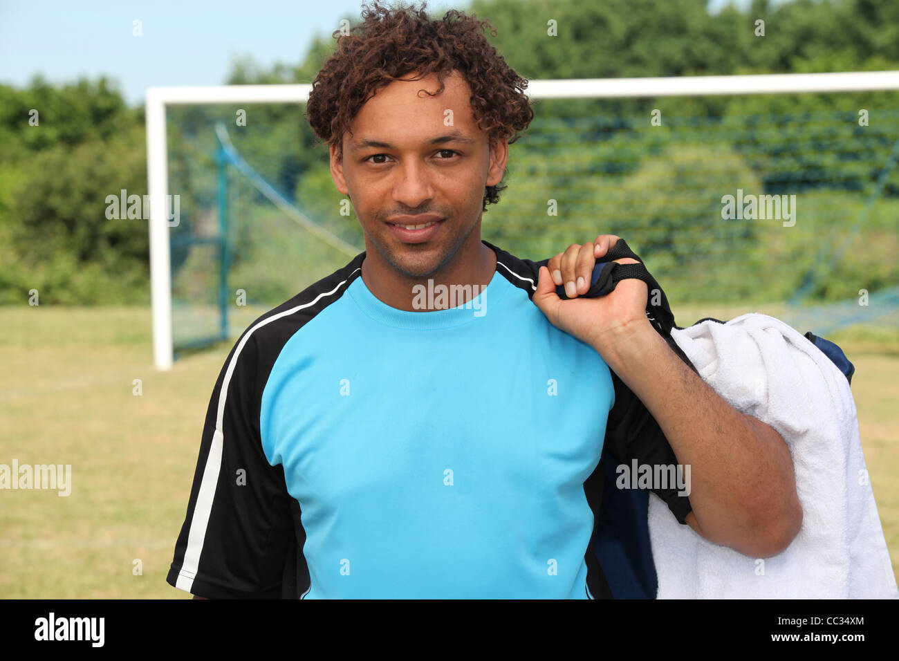 football player with bag Stock Photo - Alamy