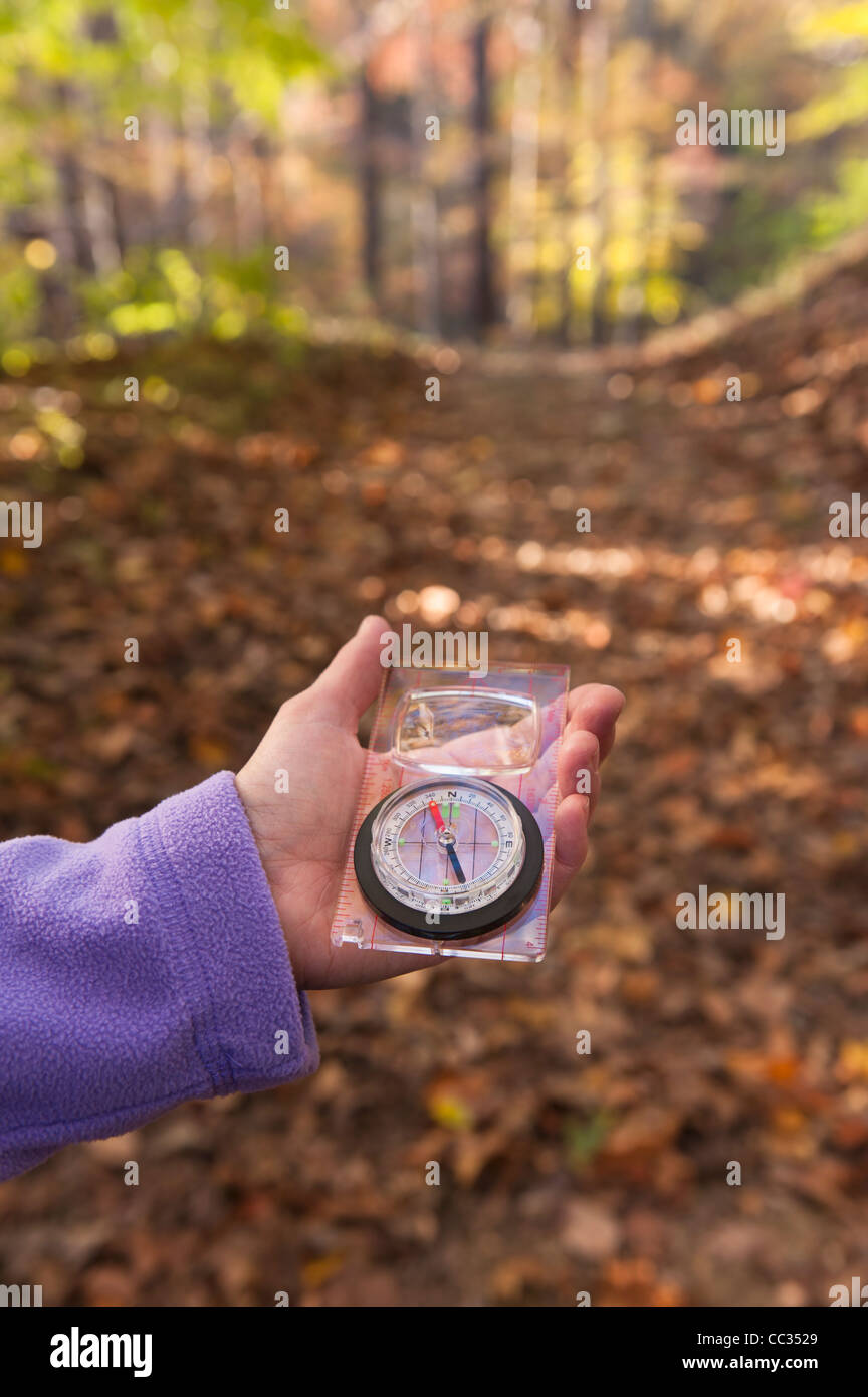USA, New Jersey, Close-up of woman's hand holding compass in Autumn ...