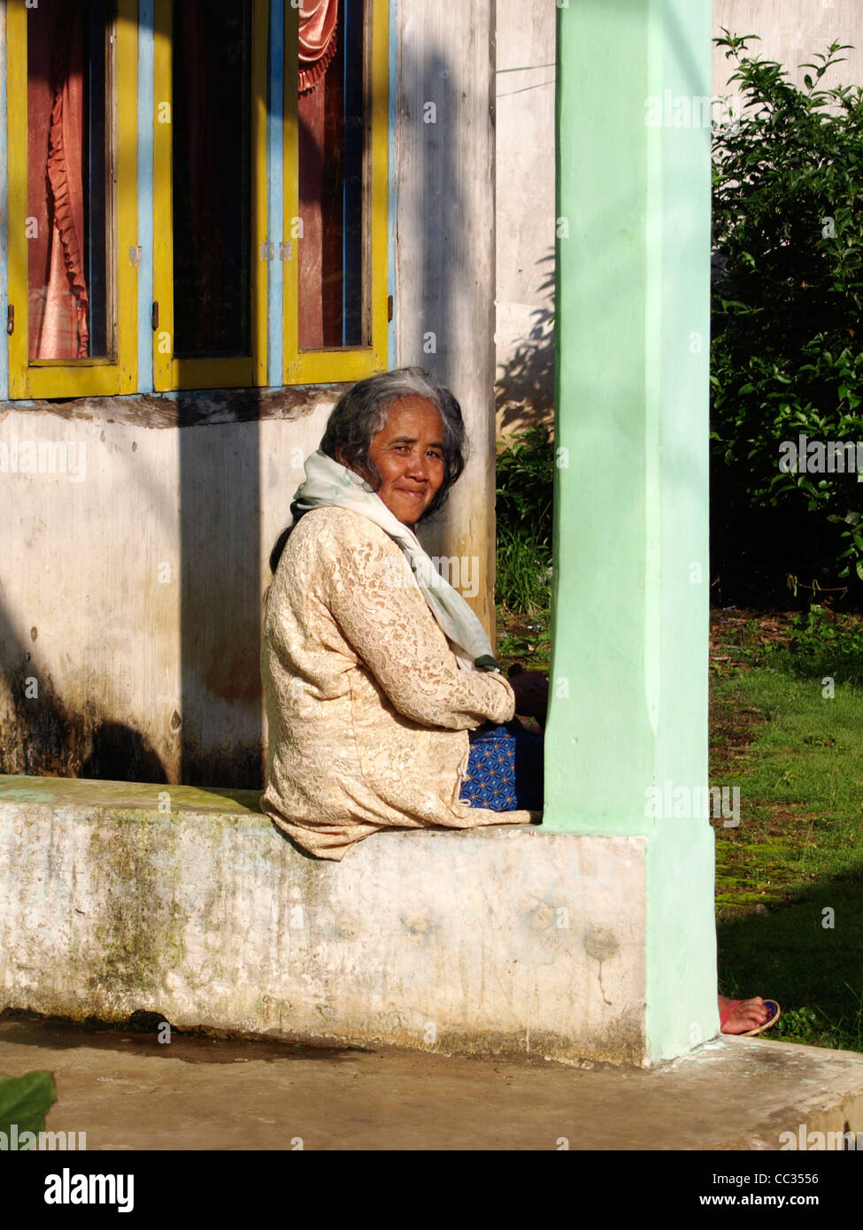 Indonesia old woman sitting hi-res stock photography and images - Alamy