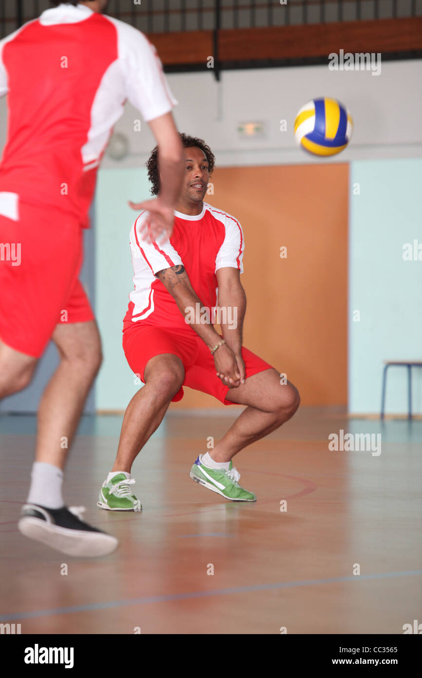 Man playing volleyball inside hi-res stock photography and images - Alamy