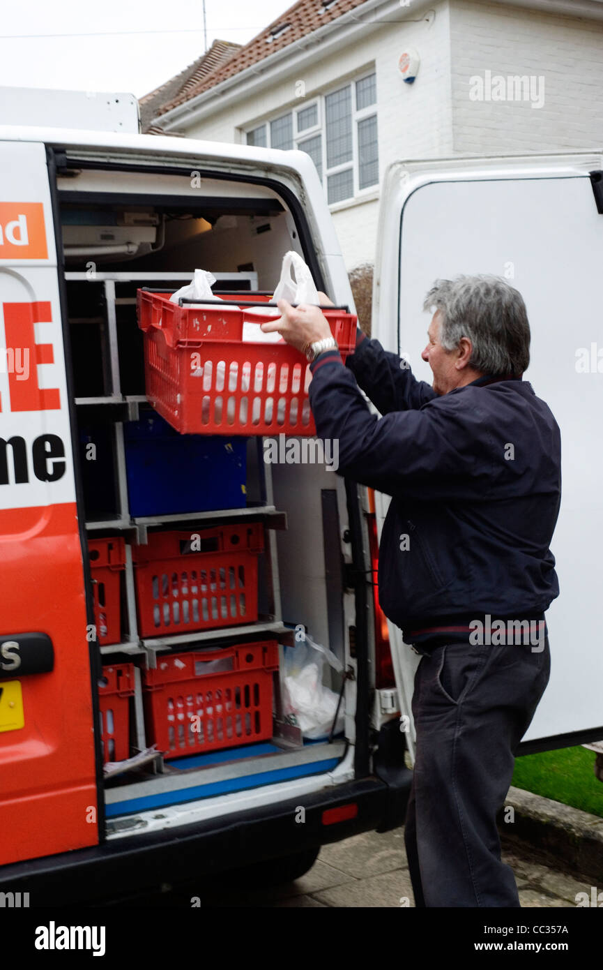 iceland home delivery driver unloading order outside of customers house ...