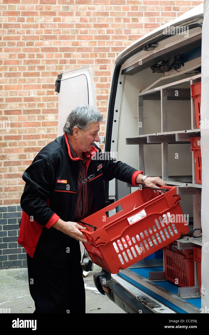 iceland home delivery driver loading van Stock Photo - Alamy