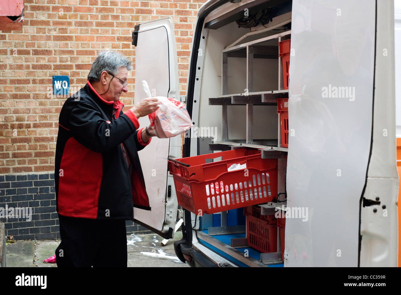 iceland home delivery driver loading van Stock Photo - Alamy