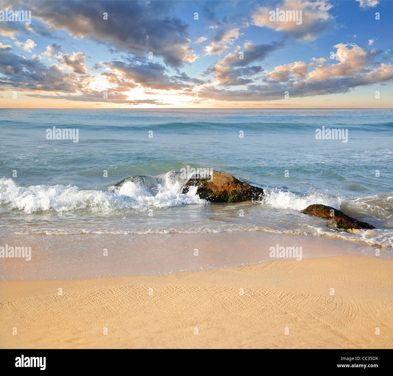 beautiful stones in the waves on ocean coast Stock Photo - Alamy