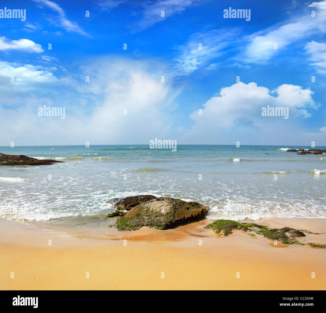 beautiful stones in the waves on ocean coast Stock Photo - Alamy