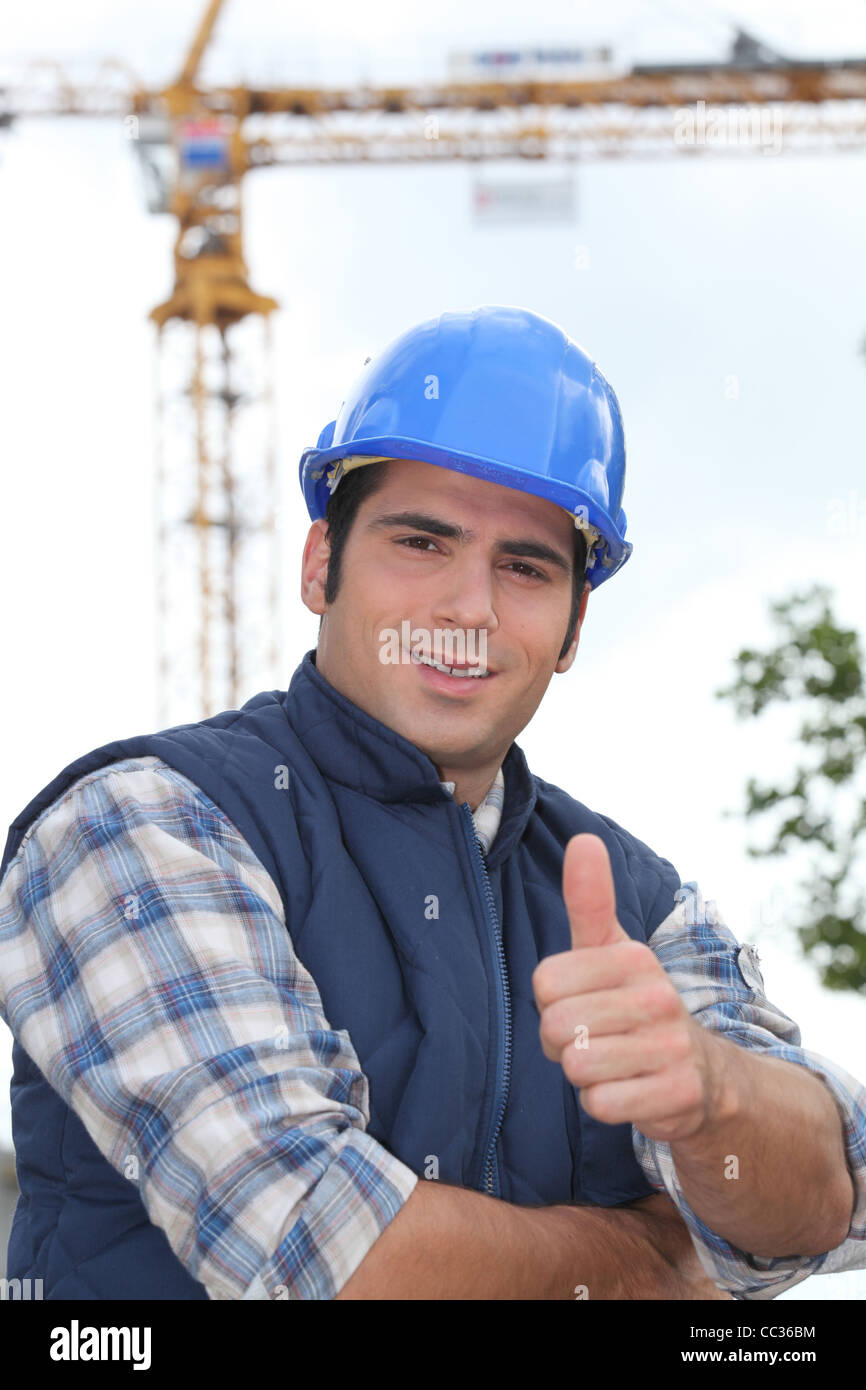 A construction worker giving the thumb up Stock Photo - Alamy