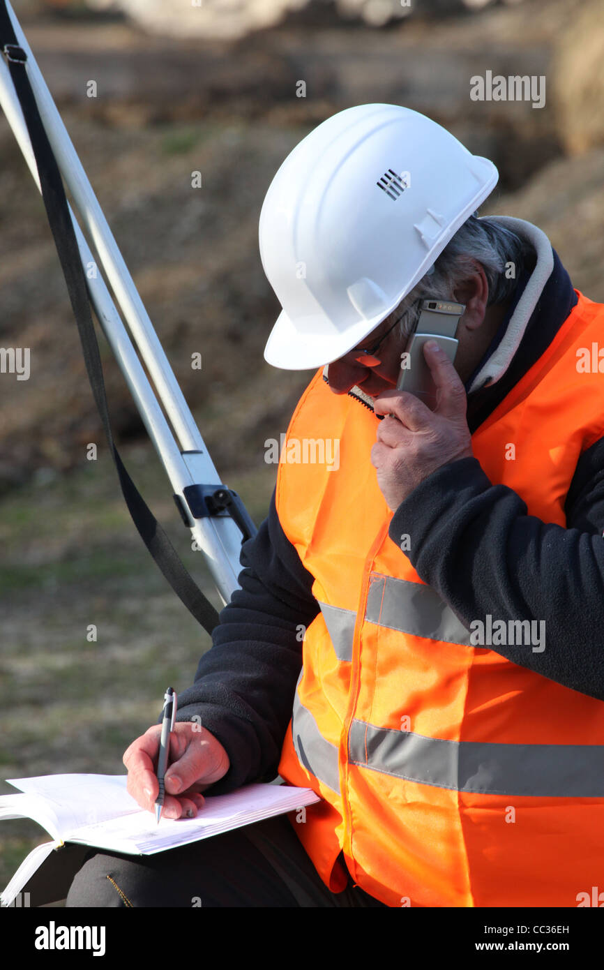 surveyor talking on the phone Stock Photo - Alamy