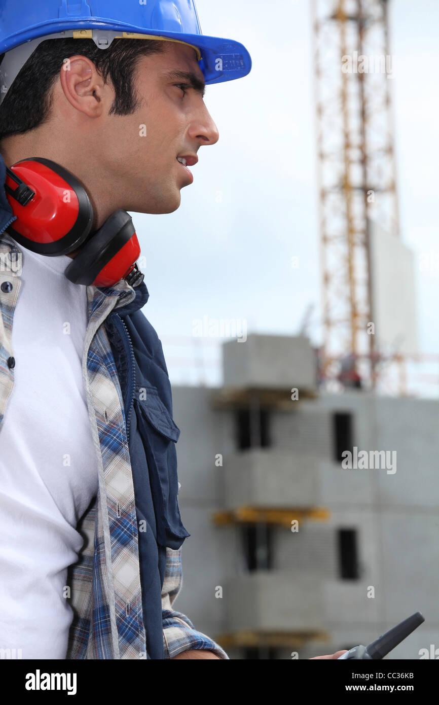 A construction worker on a building site Stock Photo - Alamy