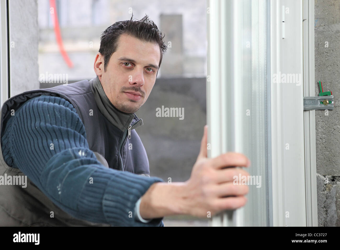 Man installing windows Stock Photo - Alamy