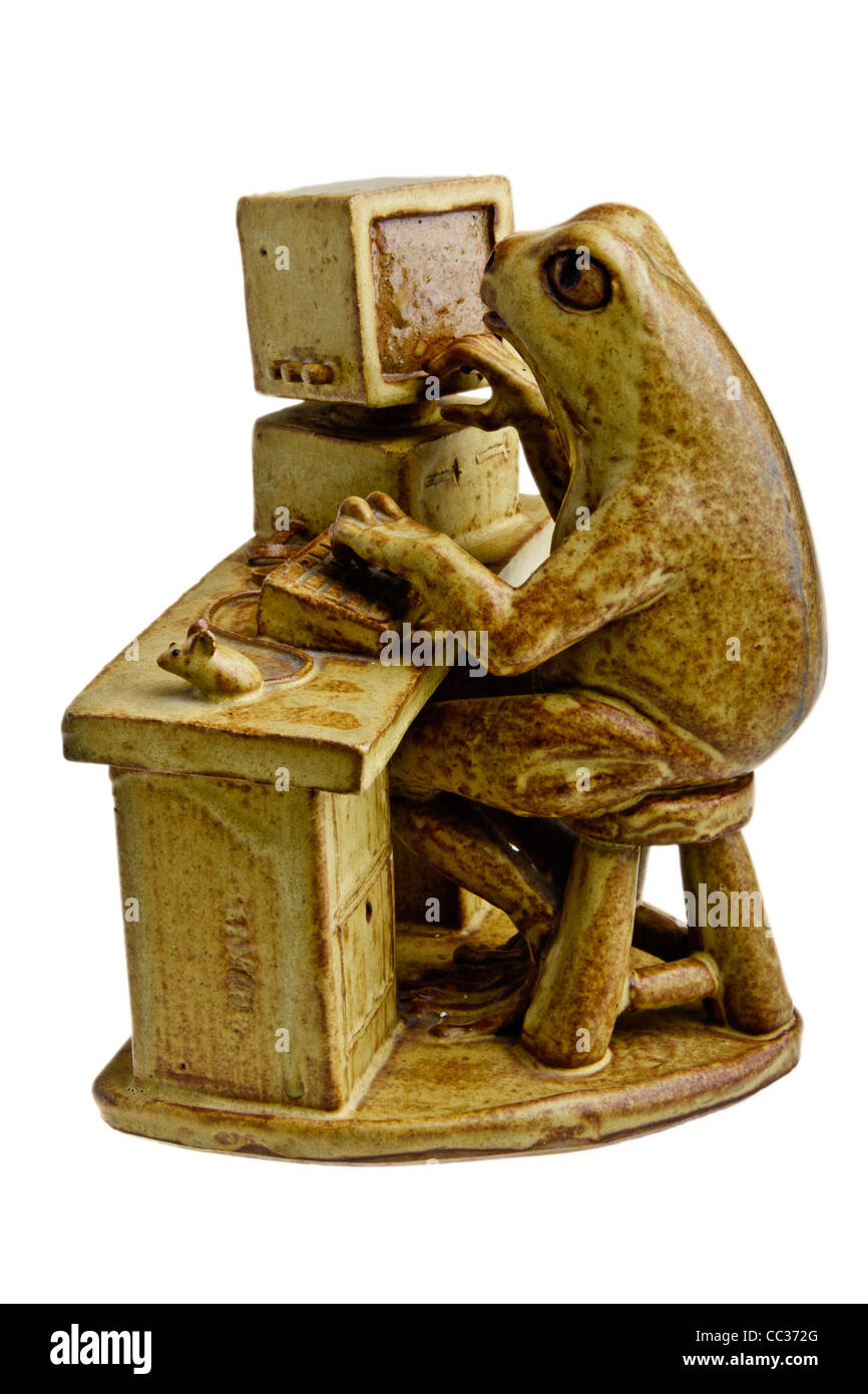 Pottery ornament depicting a frog using a computer Stock Photo - Alamy