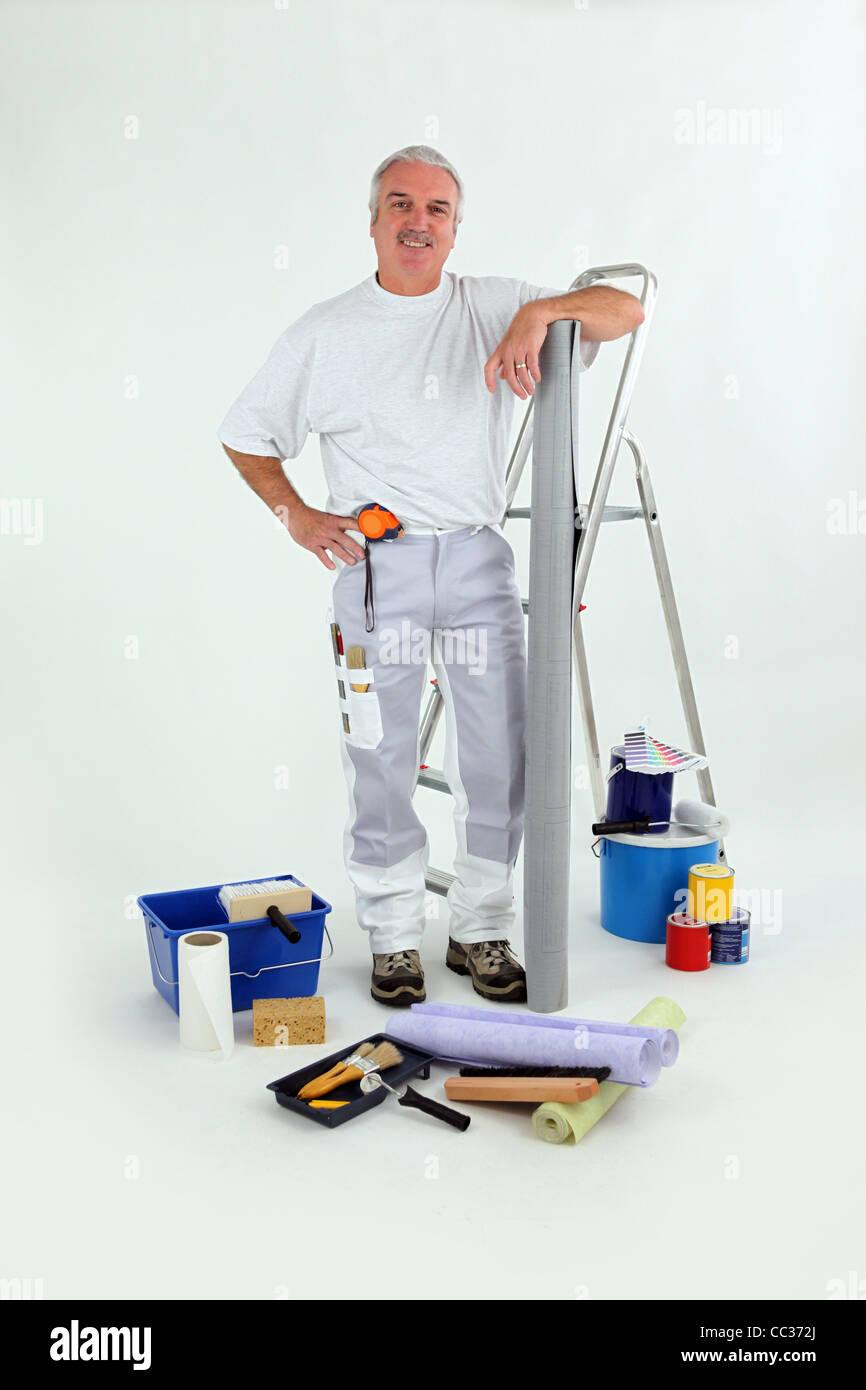 Handyman stood with step-ladder Stock Photo - Alamy