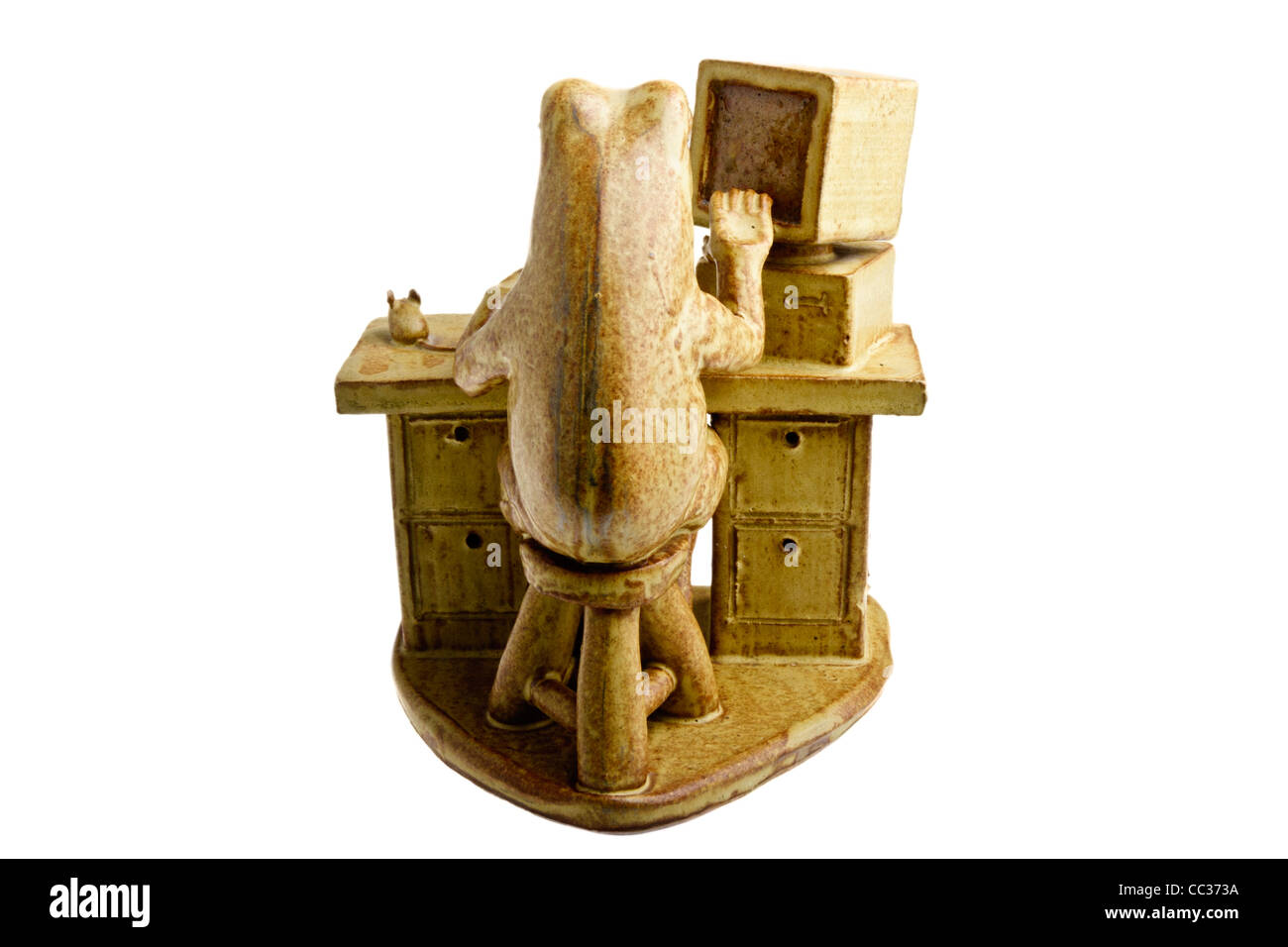 Pottery ornament depicting a frog using a computer Stock Photo - Alamy