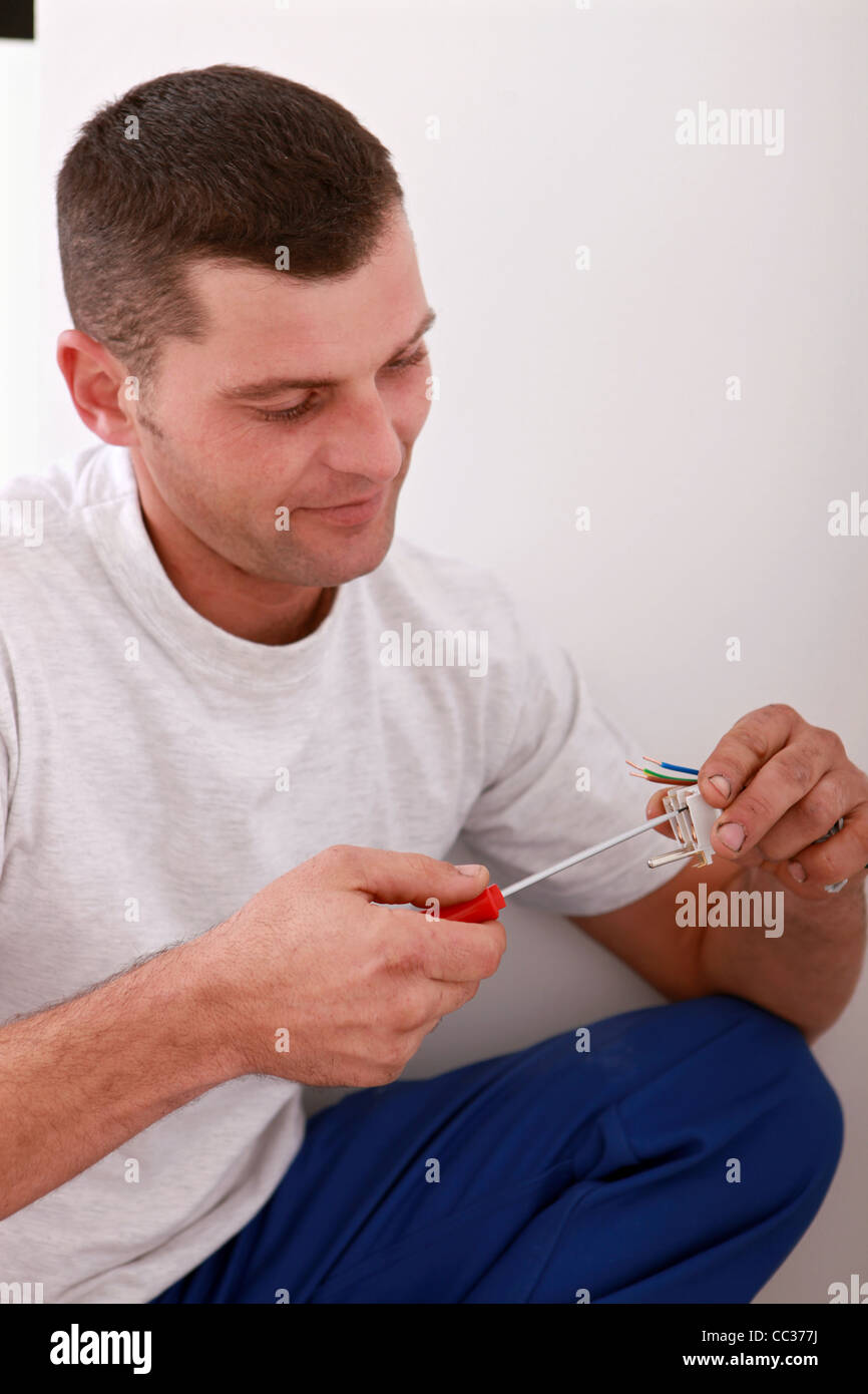 Fixing an electrical connector Stock Photo - Alamy