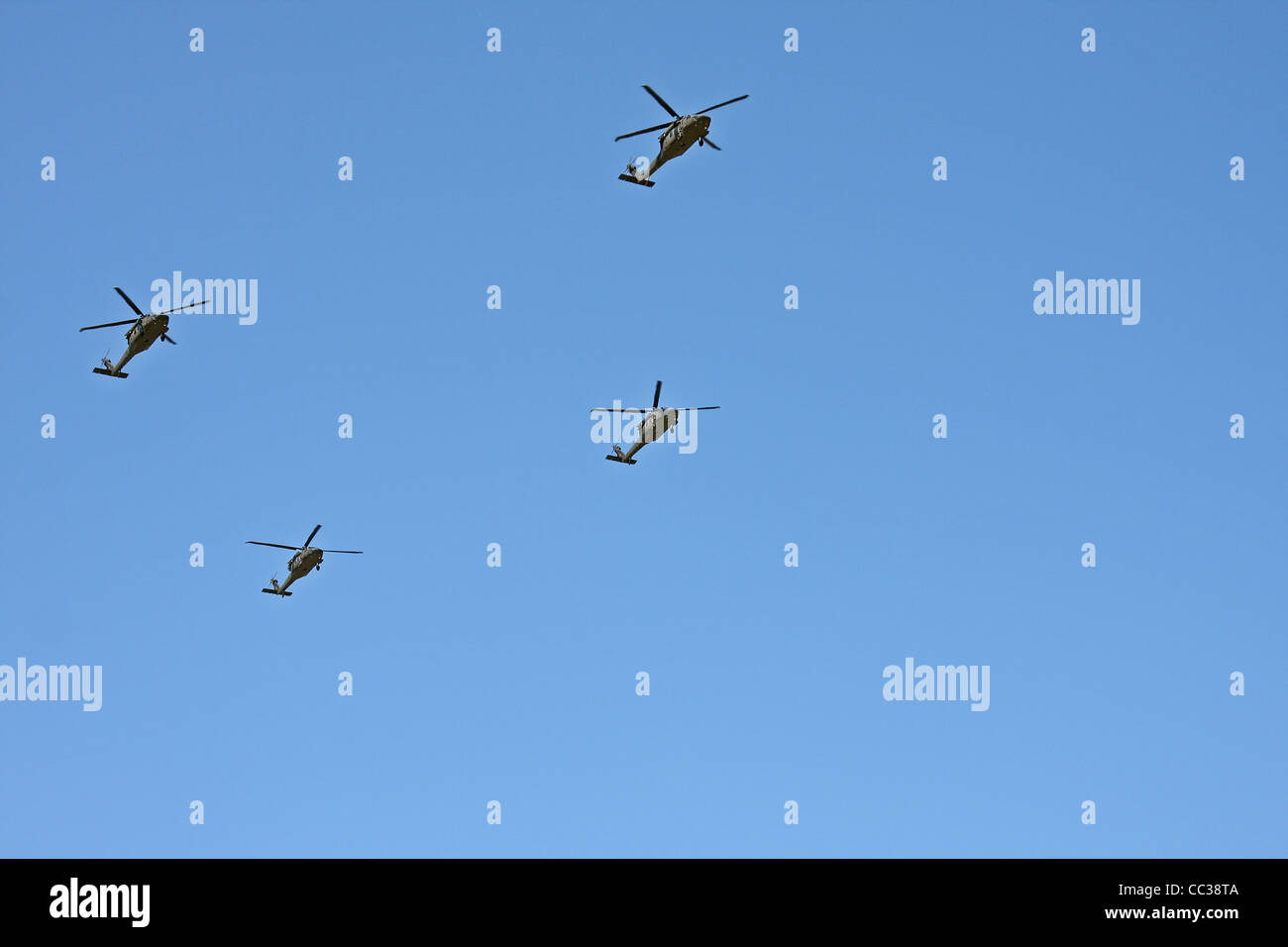 Helicopters fly high in the sky Stock Photo - Alamy