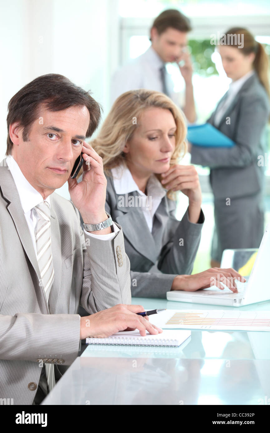 Sales team in office Stock Photo - Alamy