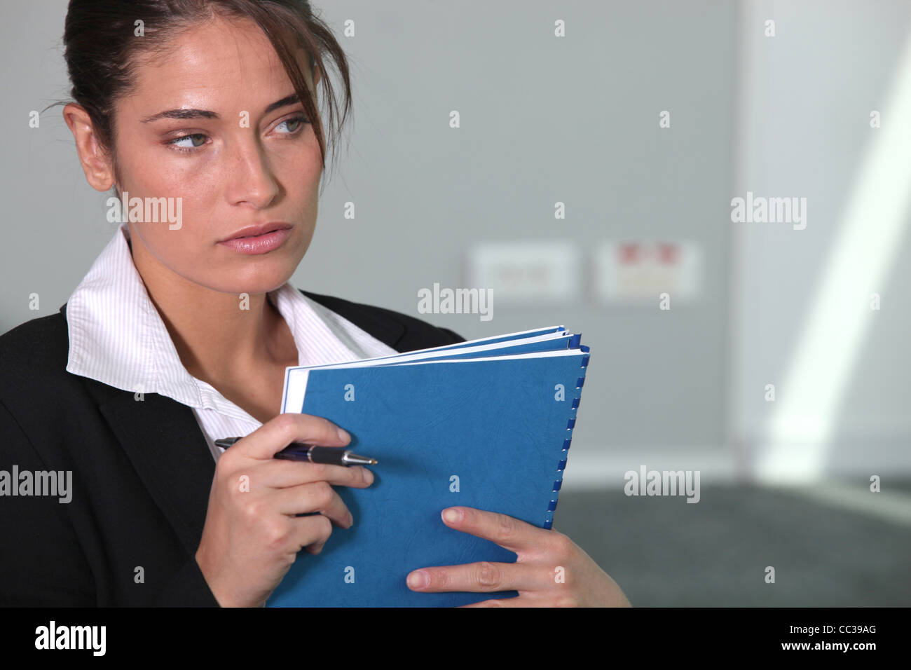 Office worker with folders Stock Photo - Alamy