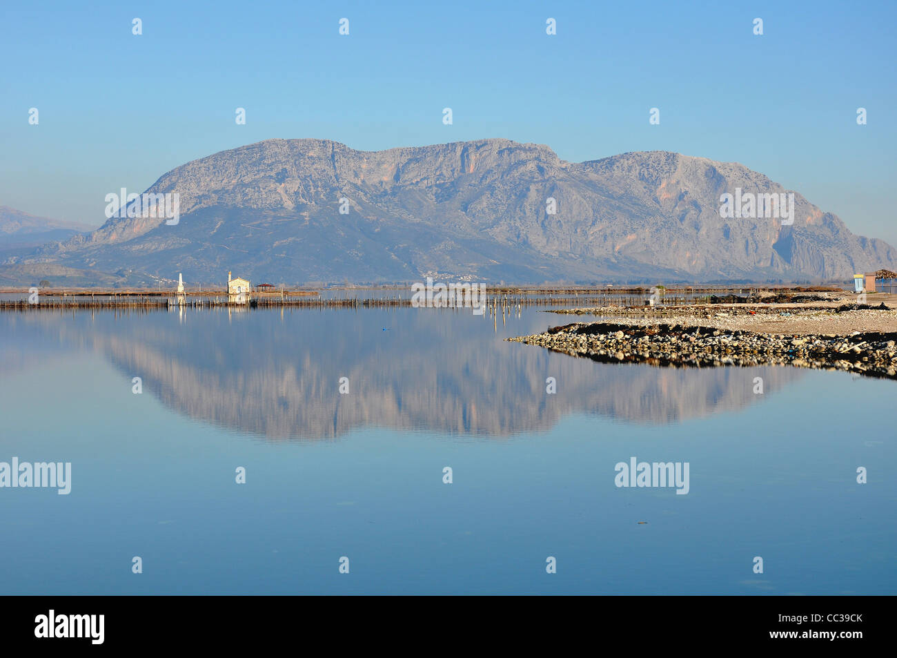 landscape reflected in calm lagoon water Stock Photo - Alamy