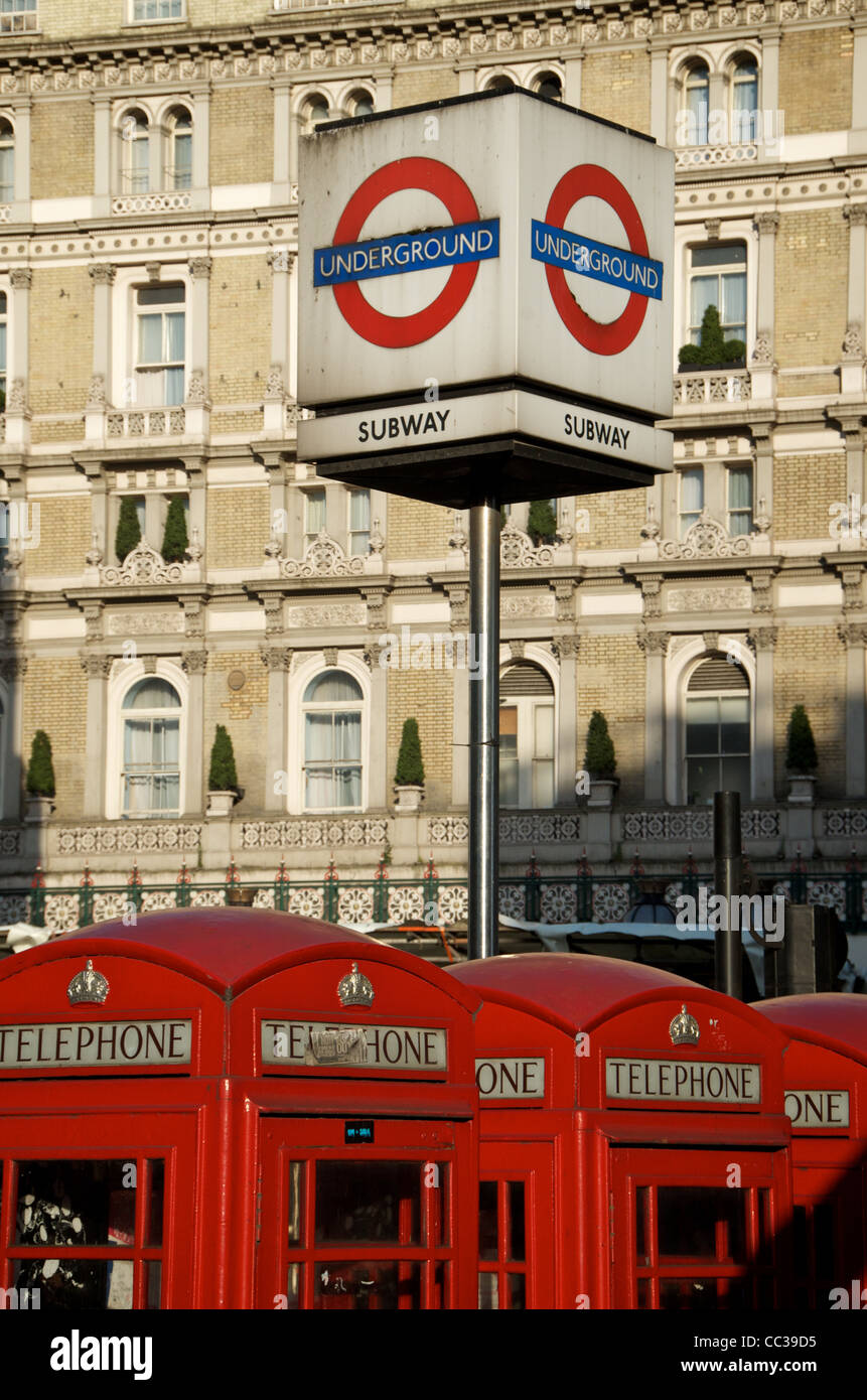 Red telephone boxes by a London underground tube station outside ...