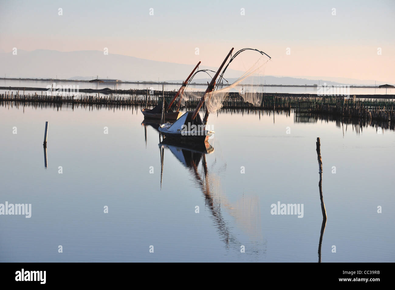 fishing boat reflection Stock Photo - Alamy