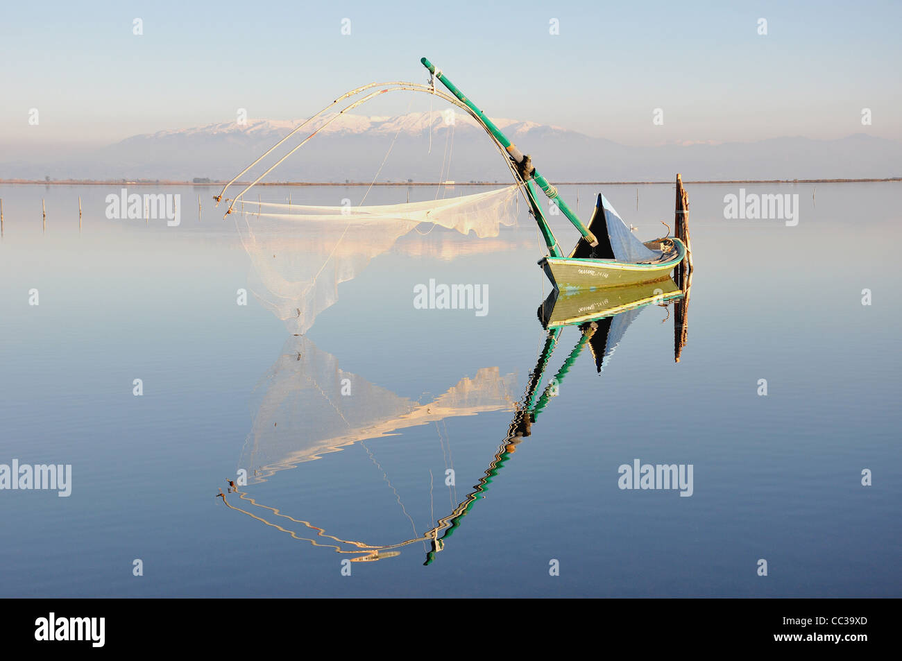 fishing boat reflection Stock Photo - Alamy