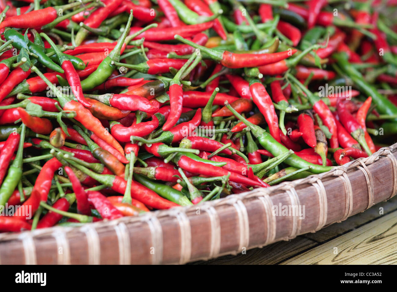 Red hot chillies on display at an outdoor market in Asia Stock Photo ...