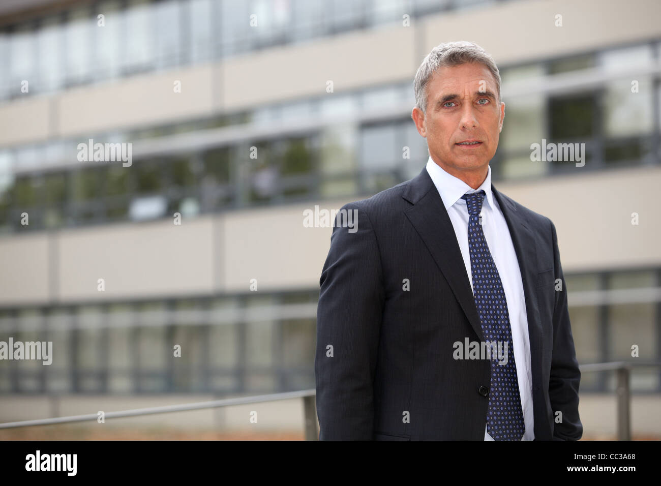 Director standing outdoors Stock Photo - Alamy