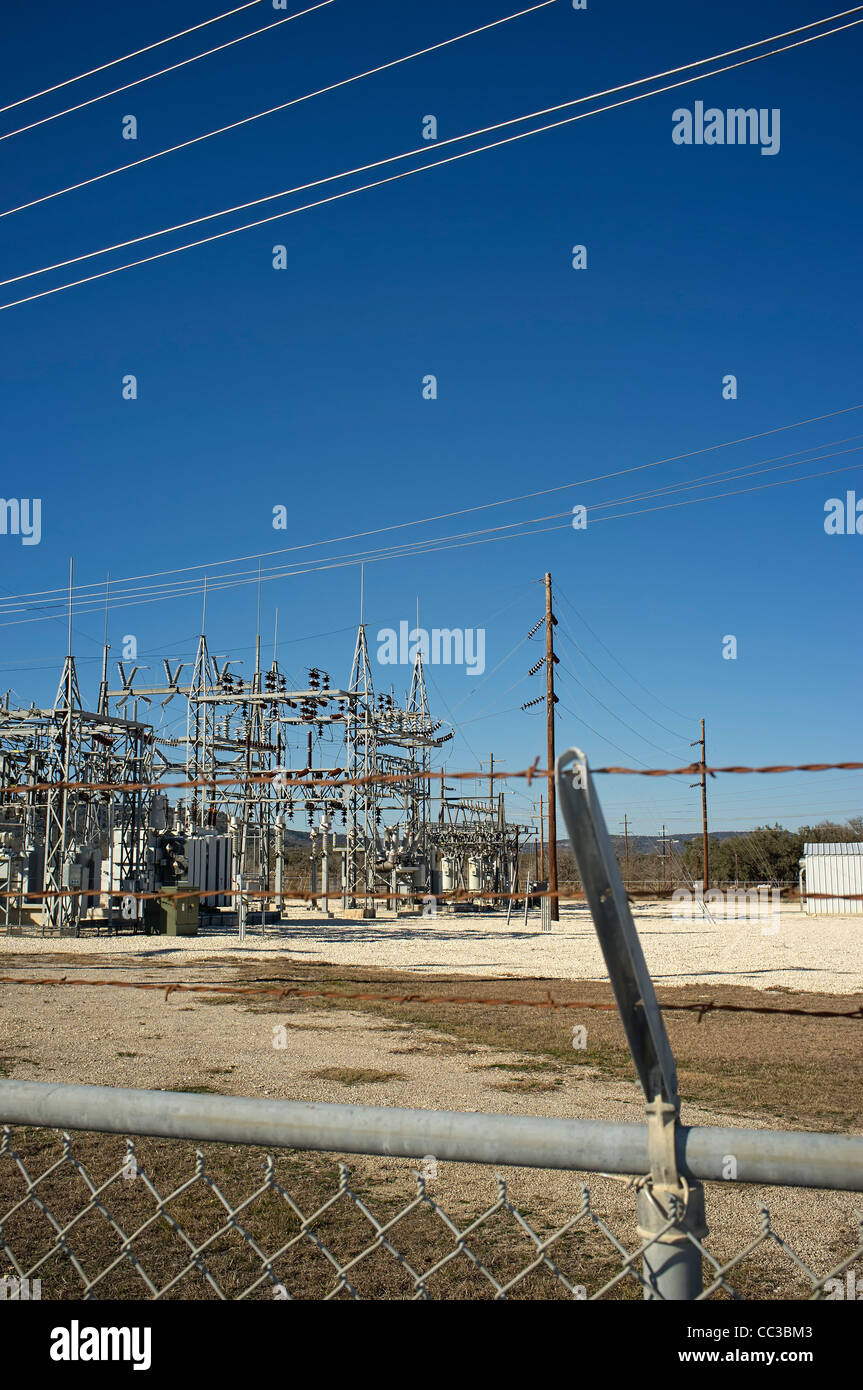 Voltage transformer and distribution station protected by chain link ...