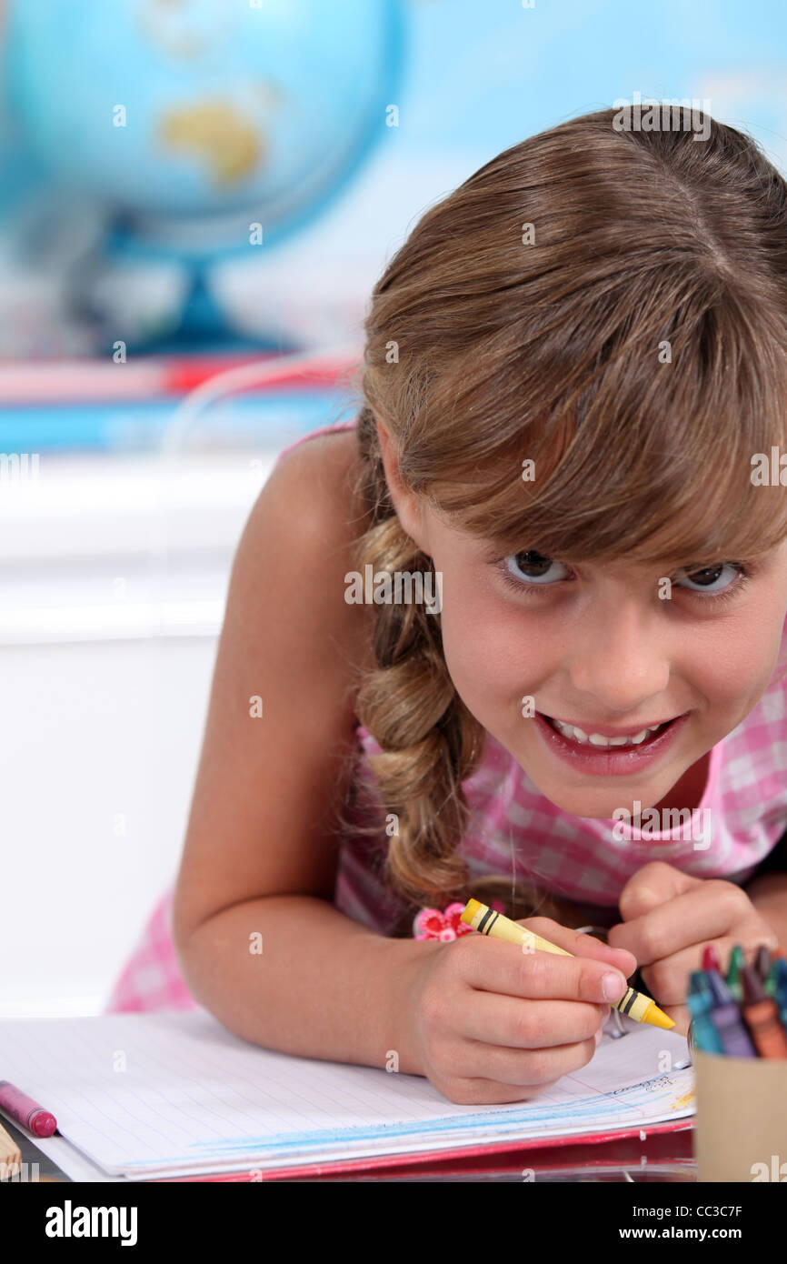 Little girl colouring with crayons Stock Photo - Alamy