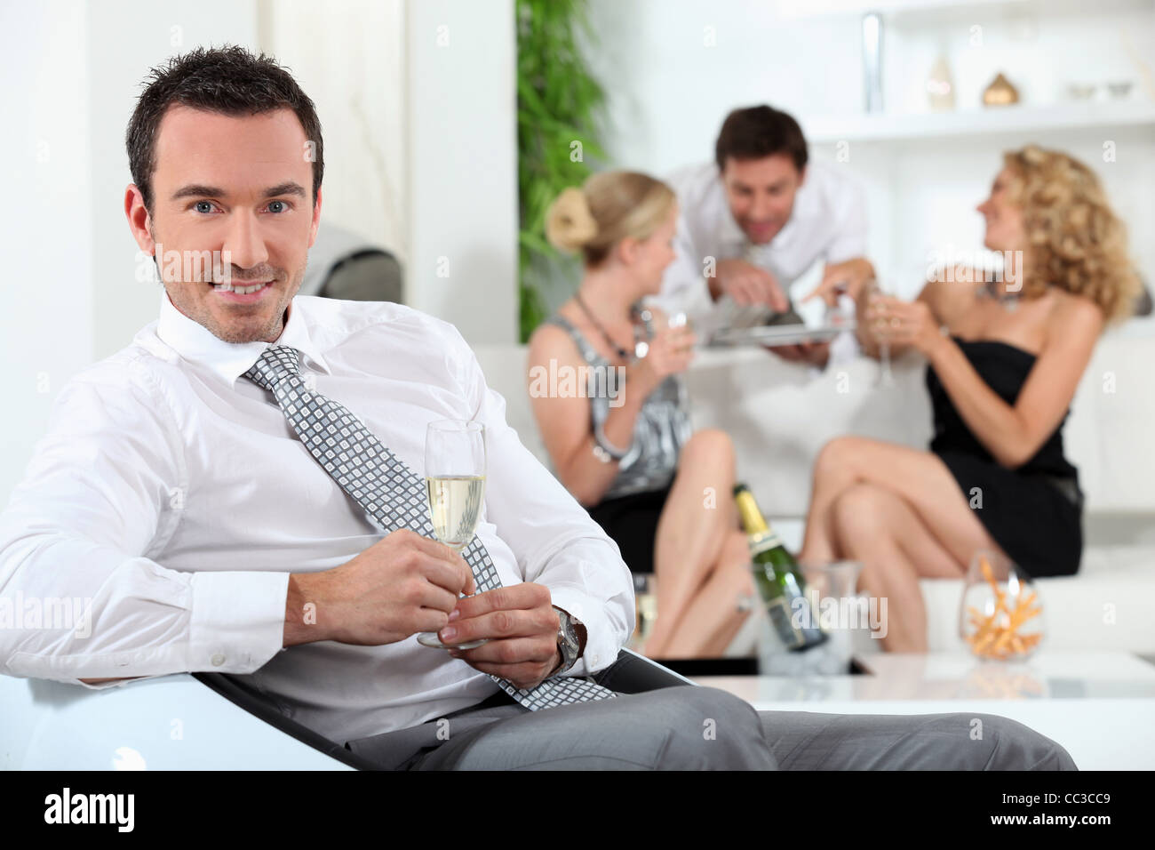 Man at a house party Stock Photo - Alamy