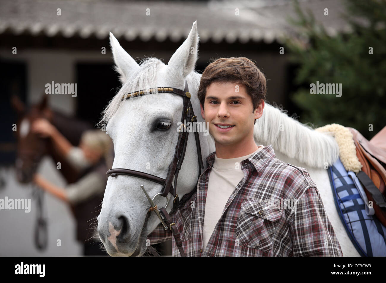 portrait of a young man with horse Stock Photo - Alamy