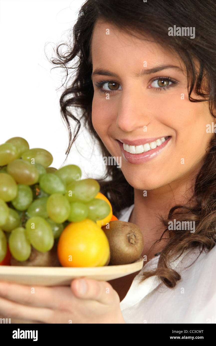 a woman holding a fruits plate Stock Photo - Alamy