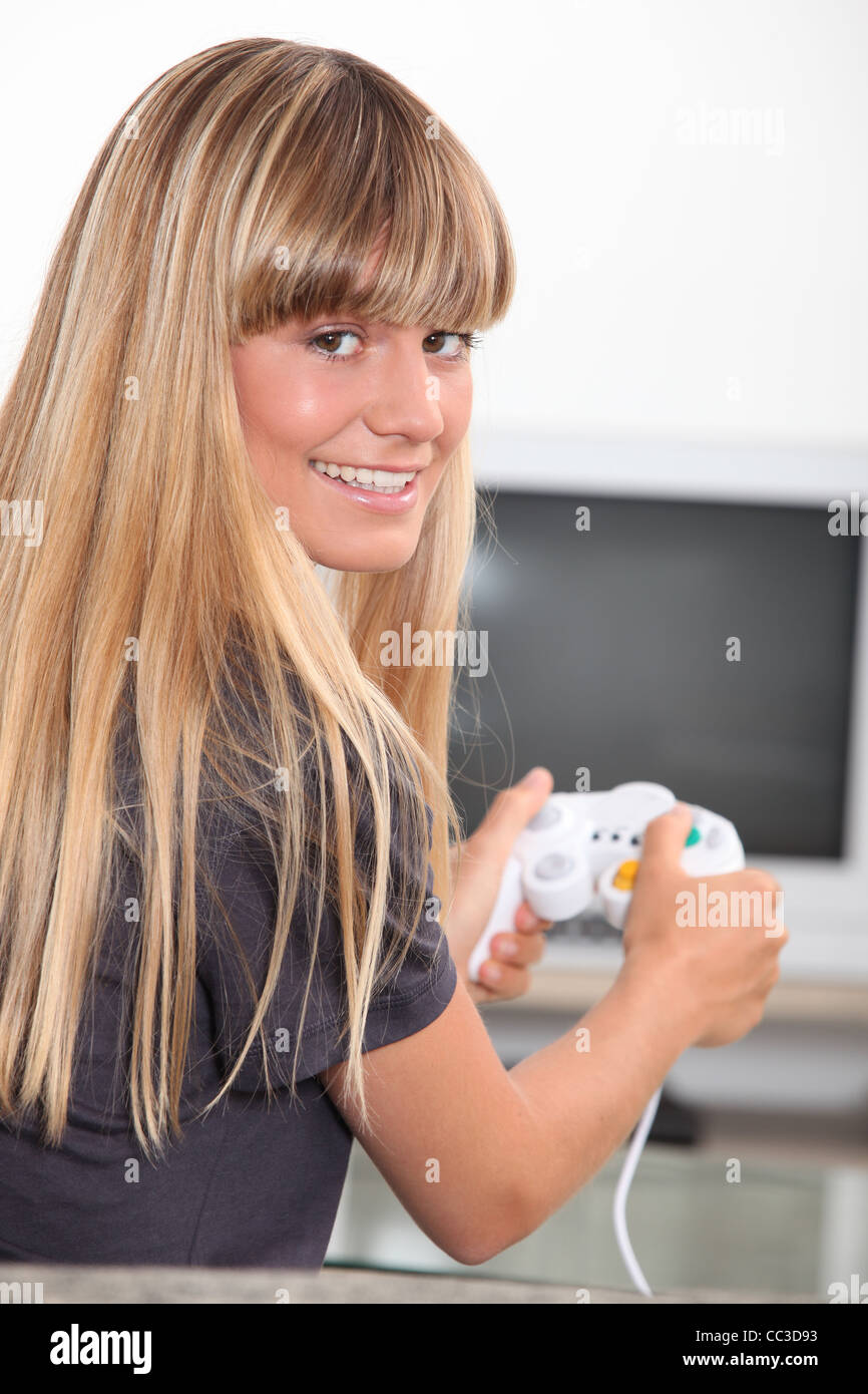Young woman playing computer game Stock Photo - Alamy