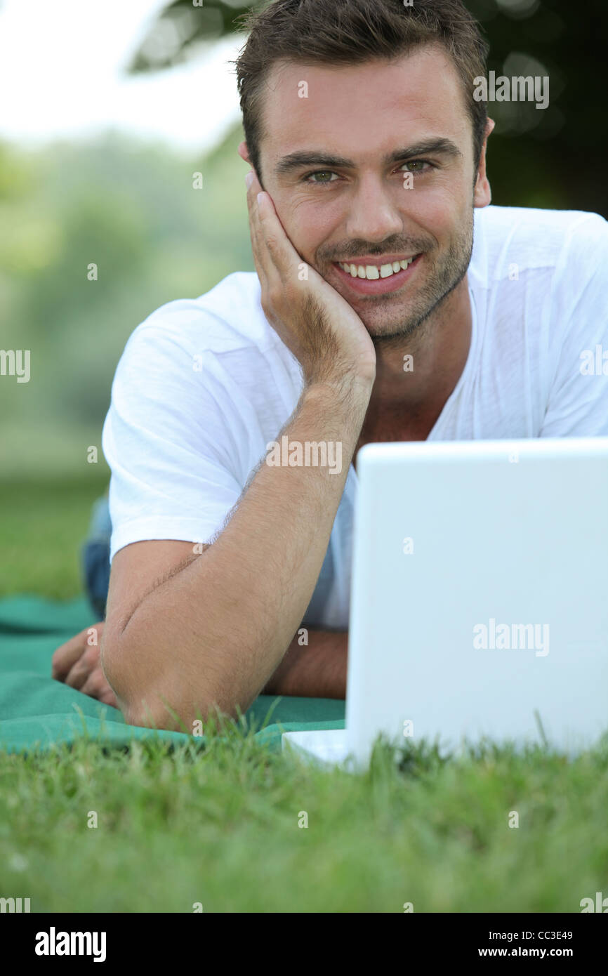 Man on laptop outside Stock Photo - Alamy
