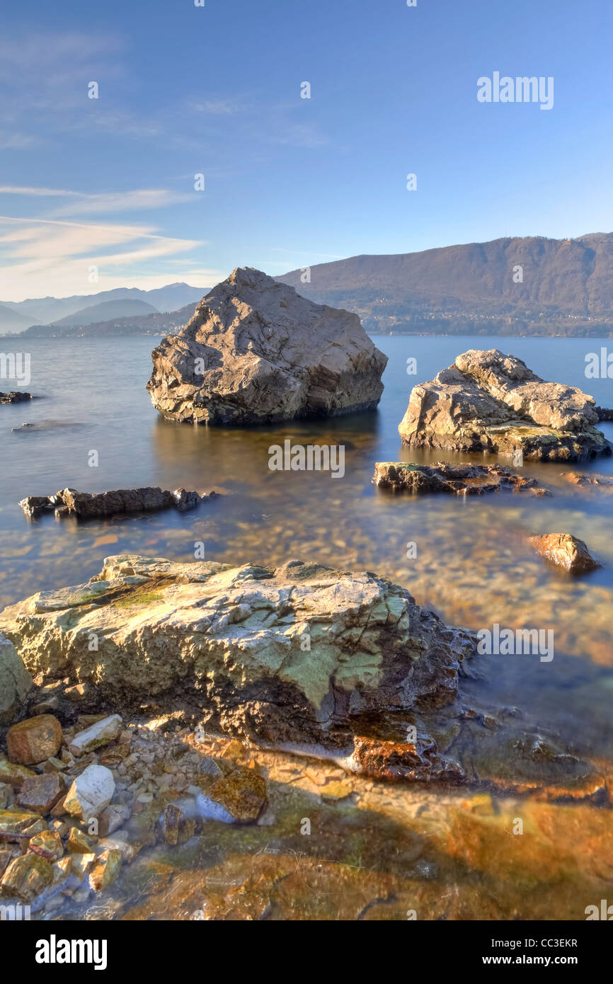 Rocky beach Calde, Lombardy, Italy with limestones in the Lago Maggiore ...