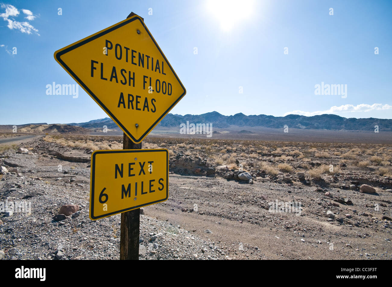 Potential Flash Flood Area yellow road warning sign in Death Valley ... Potential Flash Flood Area yellow road warning sign in Death Valley ...