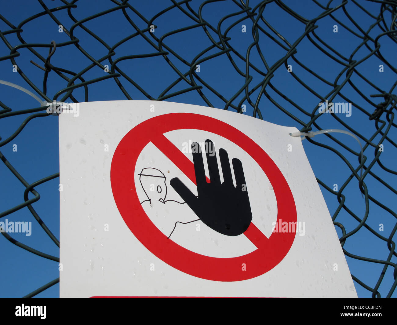 no entry sign on metal fence gate with blue sky Stock Photo - Alamy