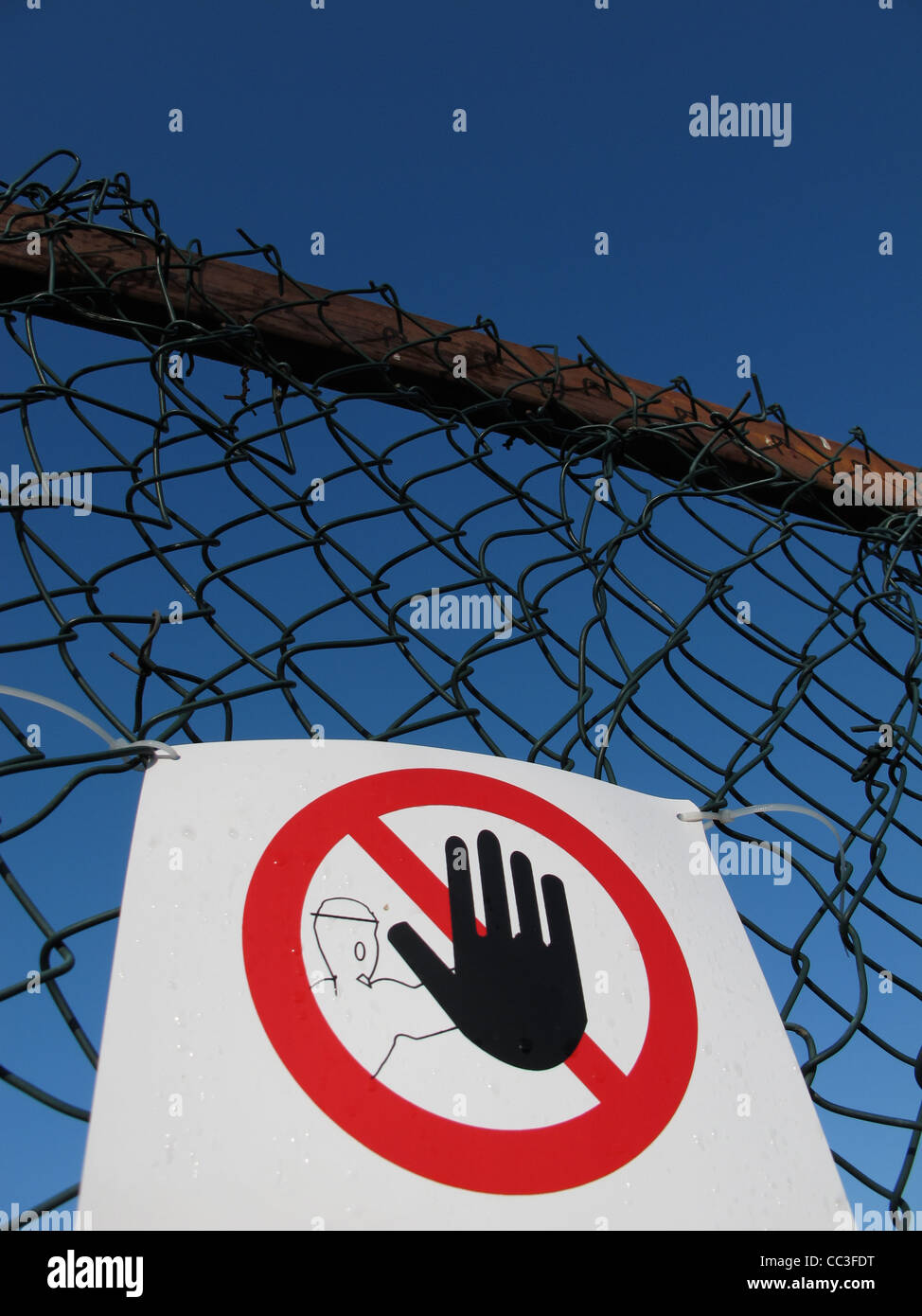 no entry sign on metal fence gate with blue sky Stock Photo - Alamy