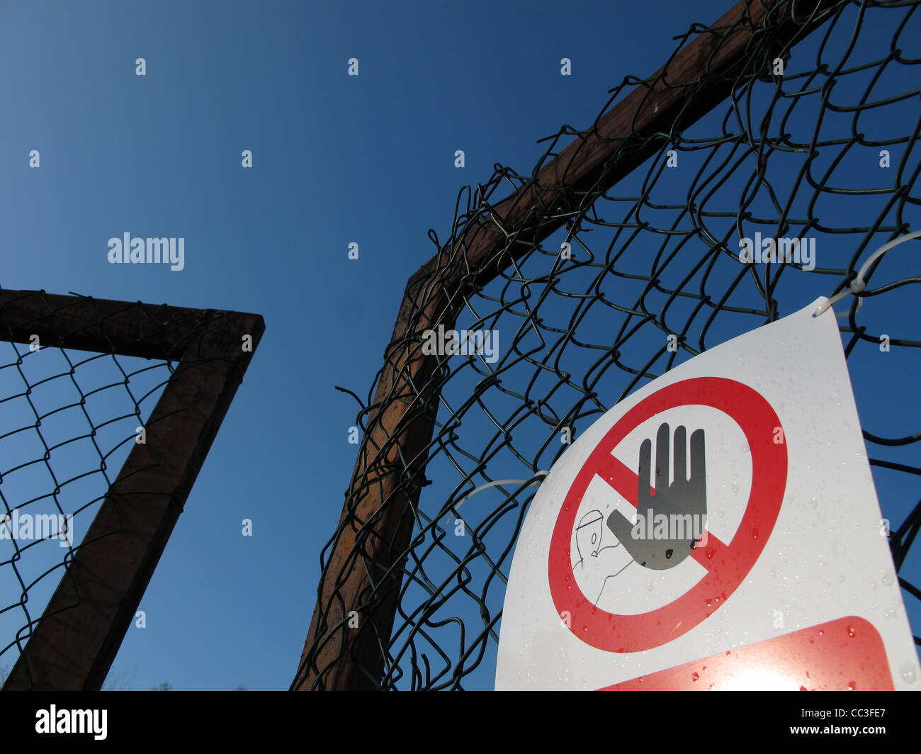 no entry sign on metal fence gate with blue sky Stock Photo - Alamy