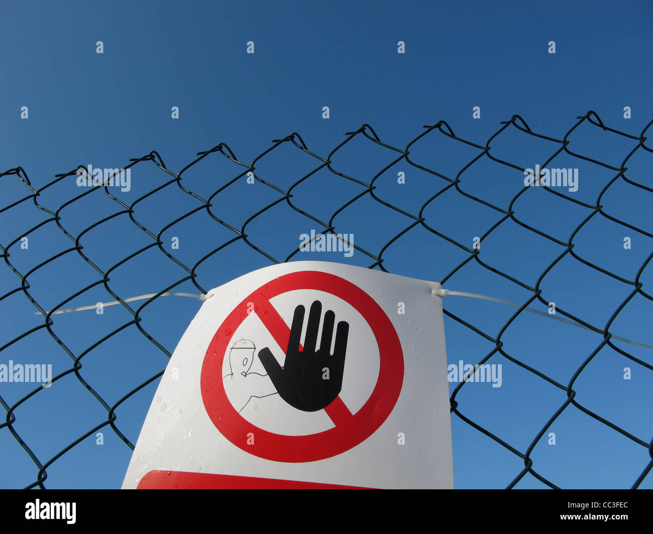 no entry sign on metal fence gate with blue sky Stock Photo - Alamy