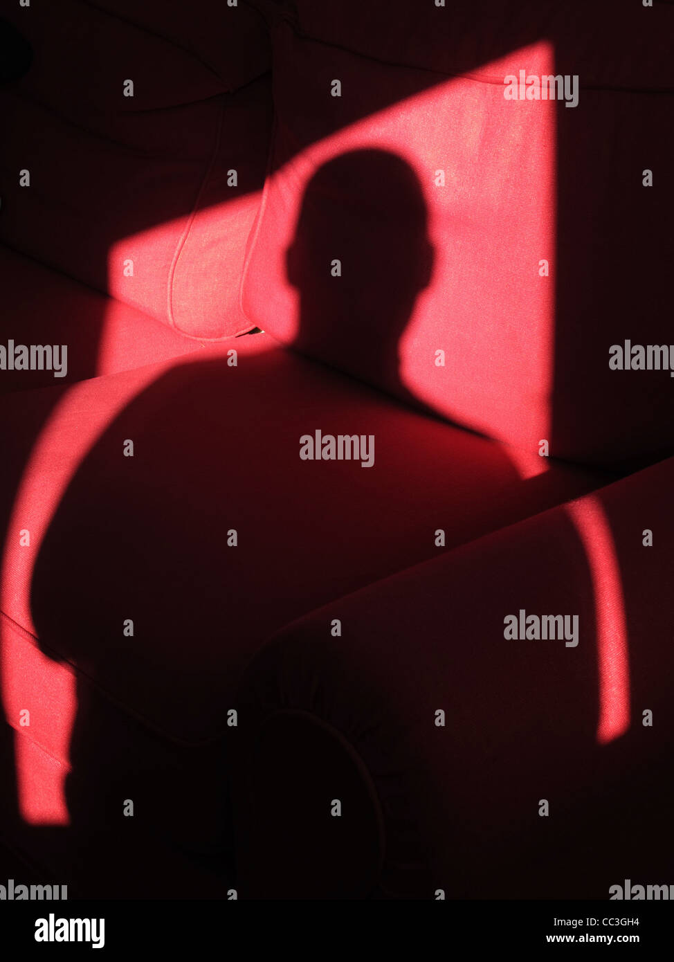 Man shadow on red wall Stock Photo - Alamy