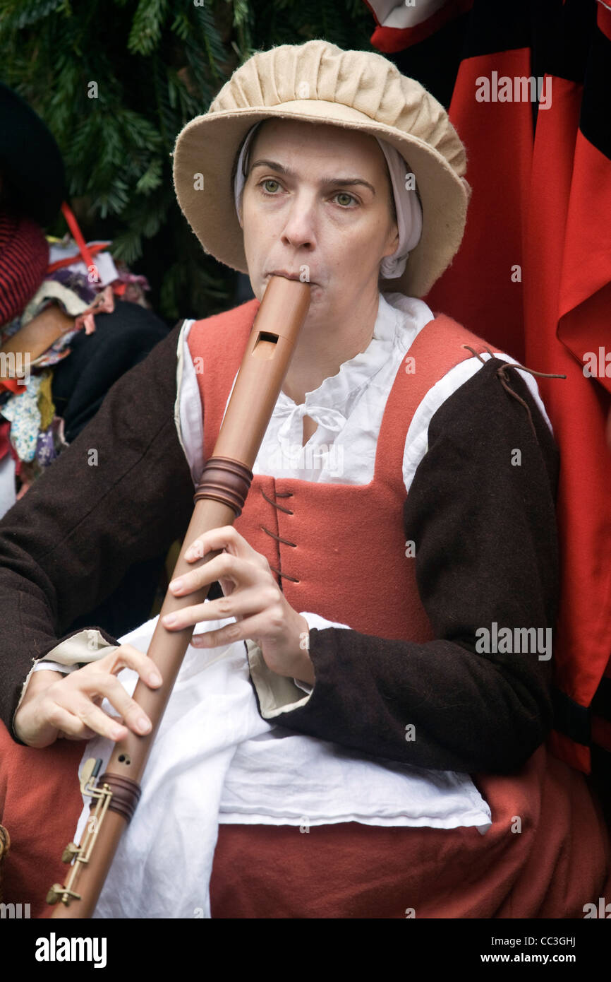 A musician plays the recorder in a traditional play to celebrate the ...