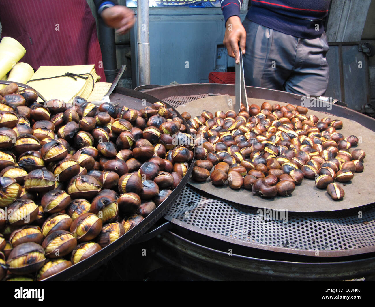 man selling hot roasted chestnuts in street in rome italy Stock Photo ...