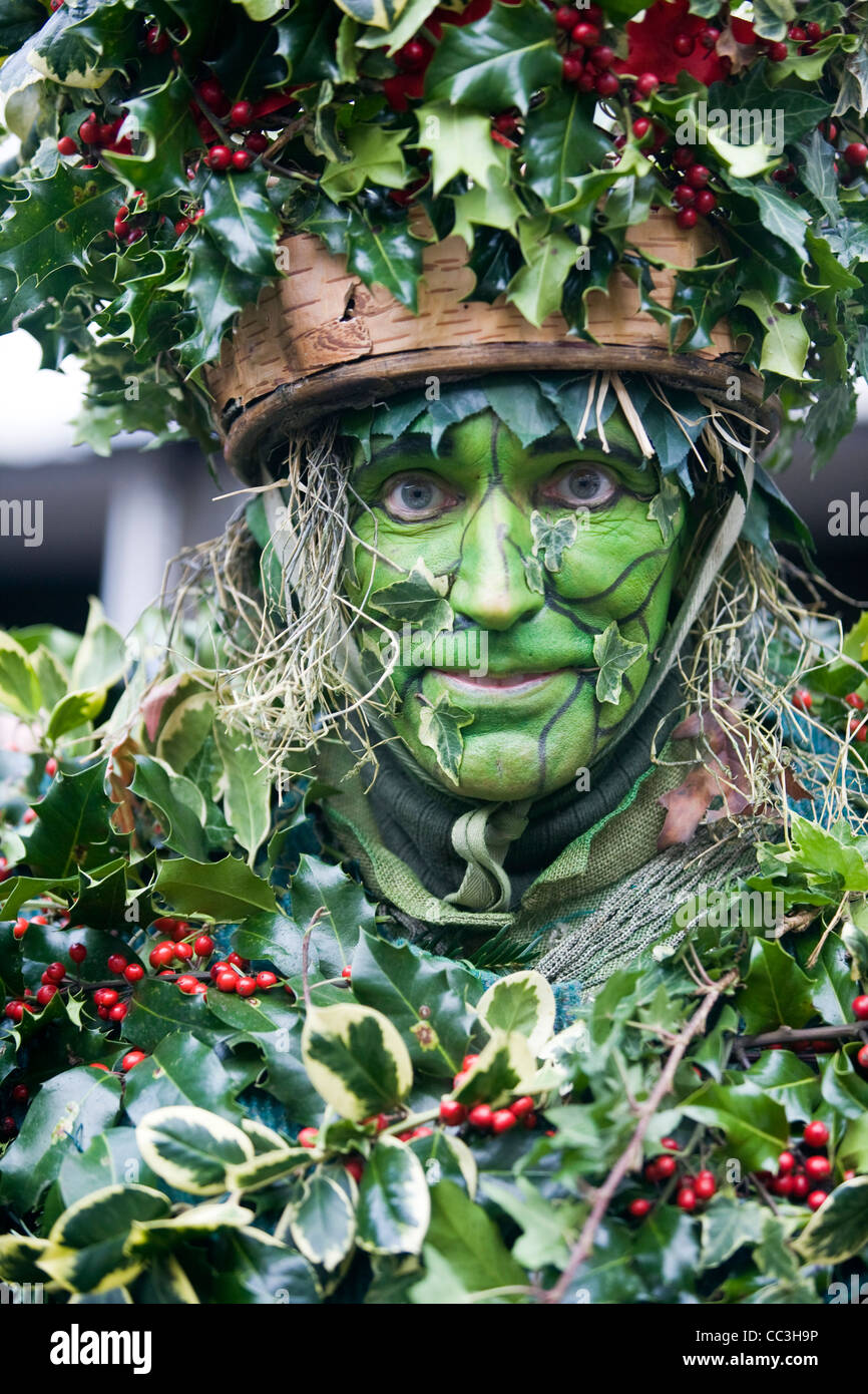 A performer dressed as the Green Man (also known as the Holly Man) acts ...