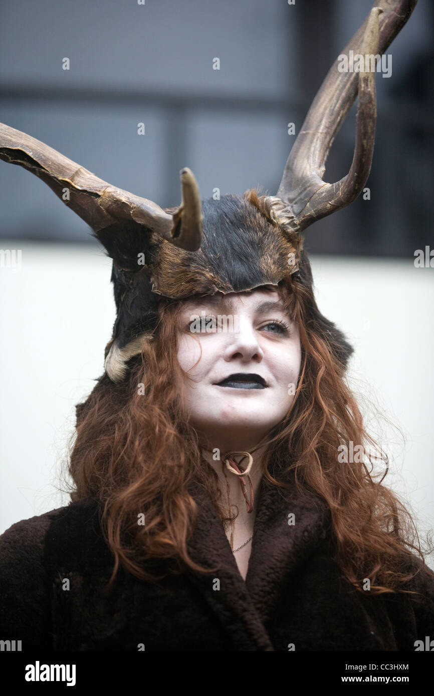 A performer dressed as a stag acts in an annual traditional play ...