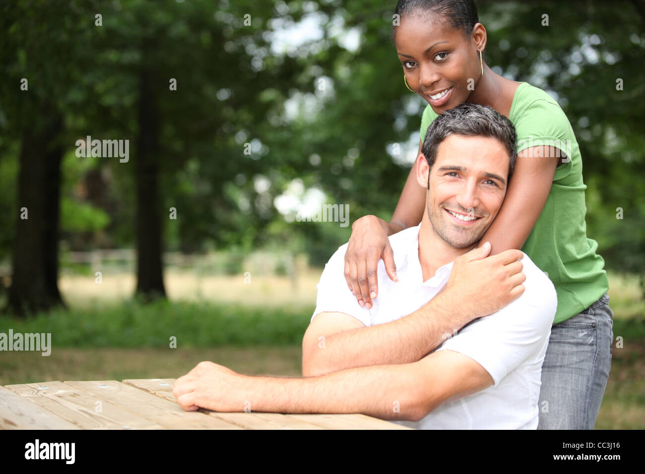 Racially mixed couple in the forest Stock Photo - Alamy