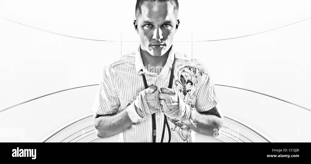 Fighter in shirt with hands wrapped in tape holding jumping rope Stock ...