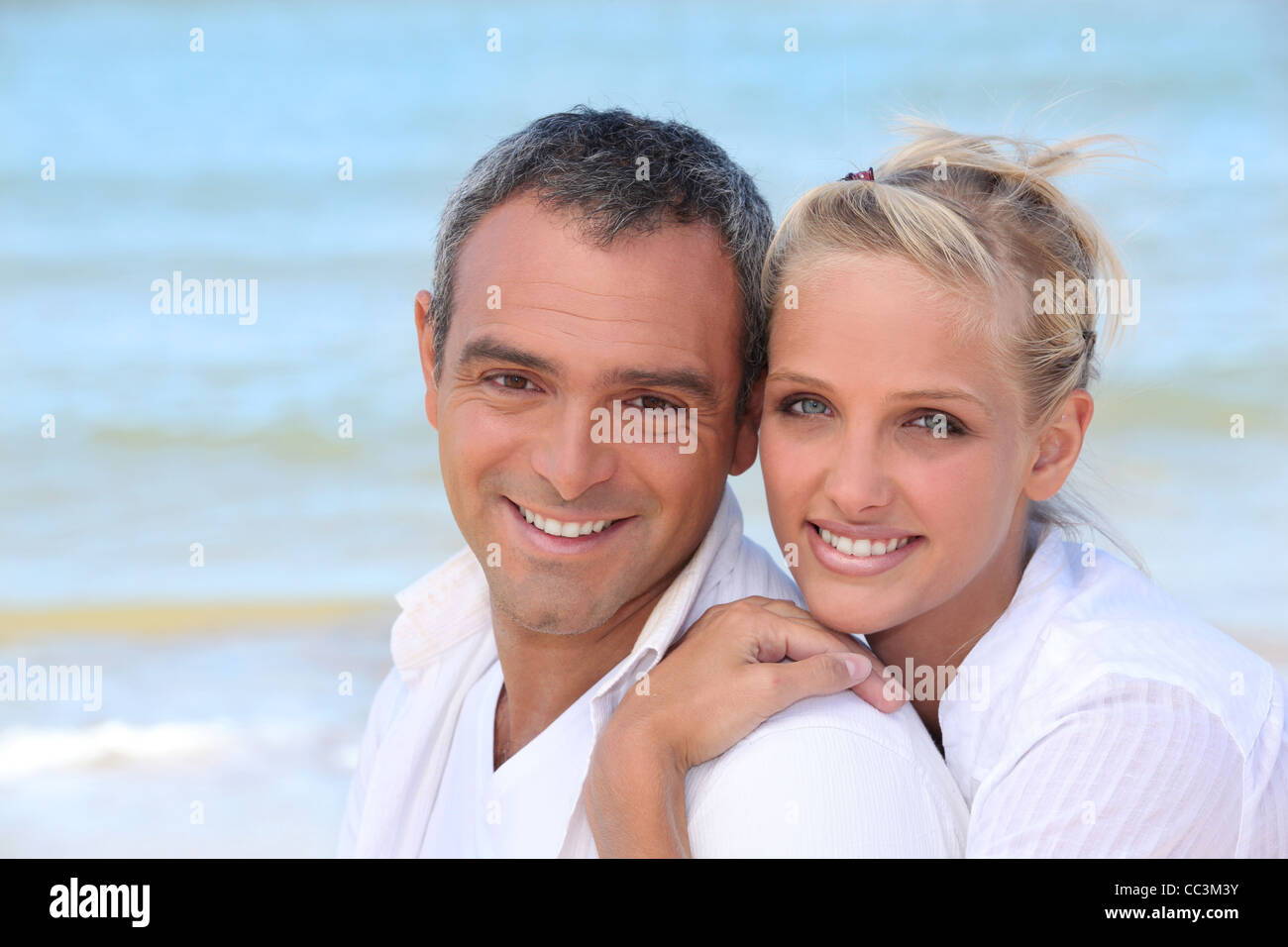 Couple by the sea Stock Photo - Alamy