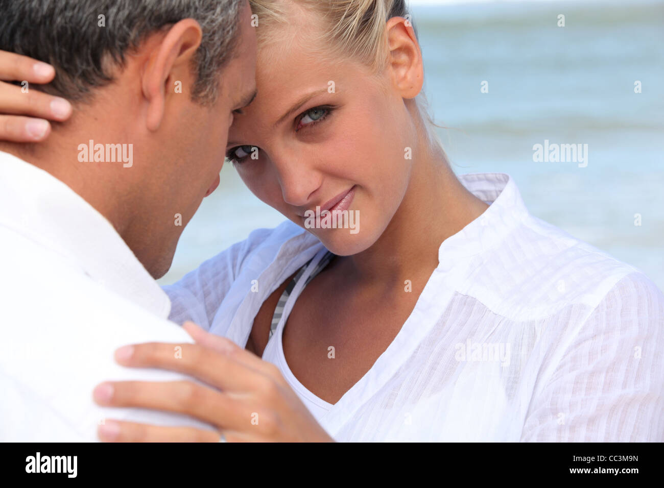 couple heads joined at sea Stock Photo - Alamy